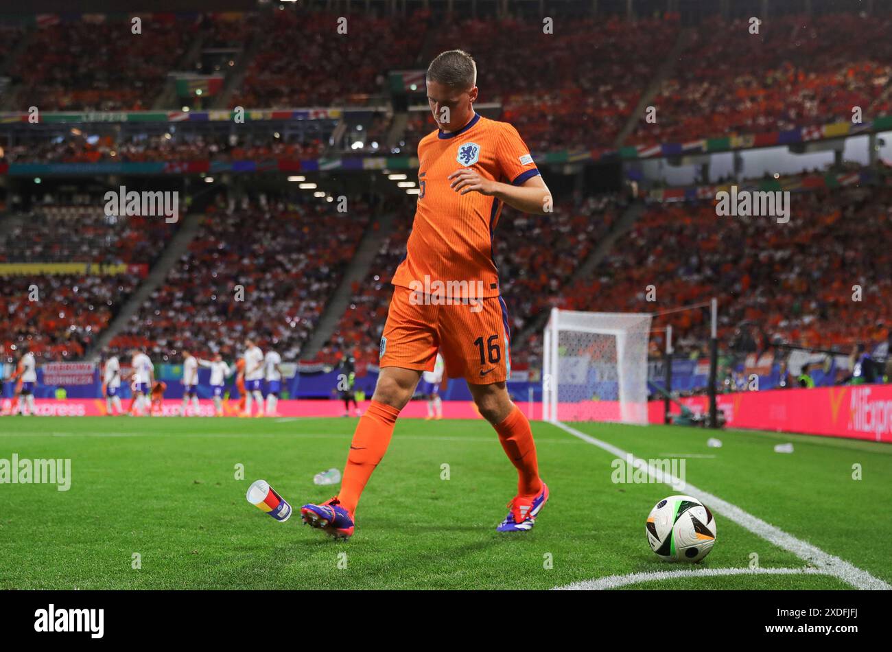 LEIPZIG, GERMANY - JUNE 21: Joey Veerman of Netherlands kicks beer mug ...