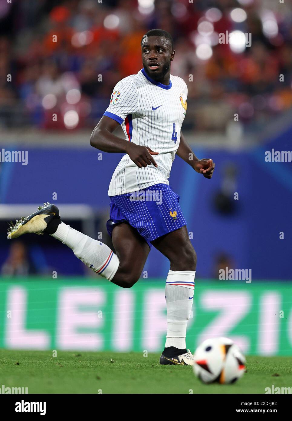 LEIPZIG, GERMANY - JUNE 21: Dayot Upamecano of France runs with a ball ...