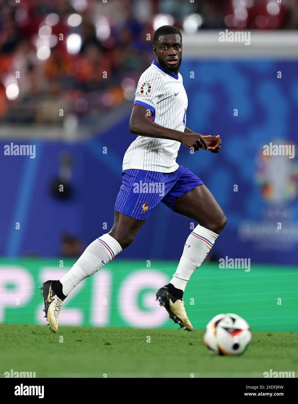 LEIPZIG, GERMANY - JUNE 21: Dayot Upamecano of France runs with a ball ...
