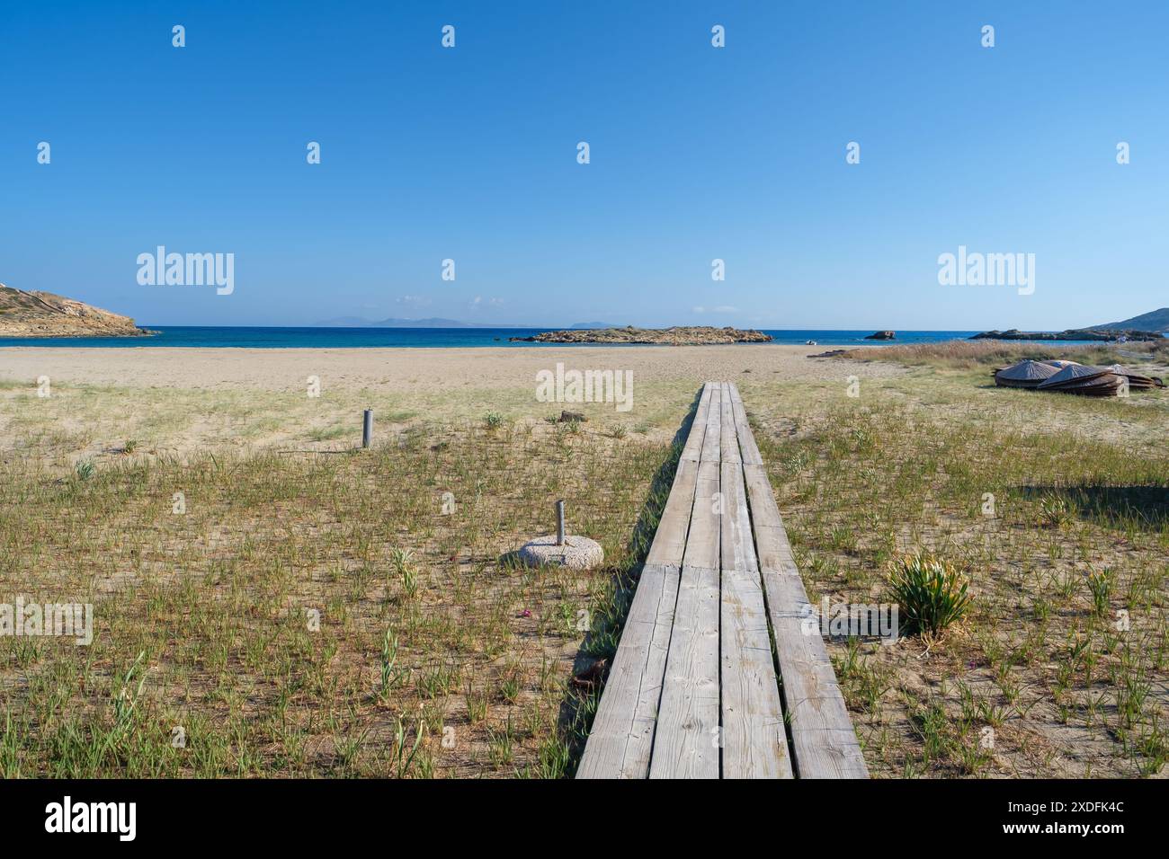 View of a wooden path leading to the beautiful sandy beach of Magganari ...