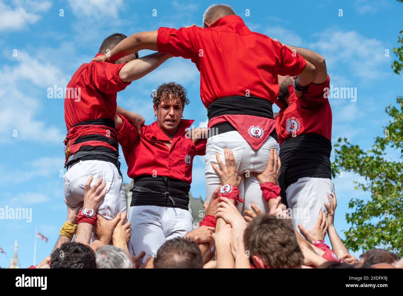 London, UK. 22 June 2024. Castellers of London build a human tower ...