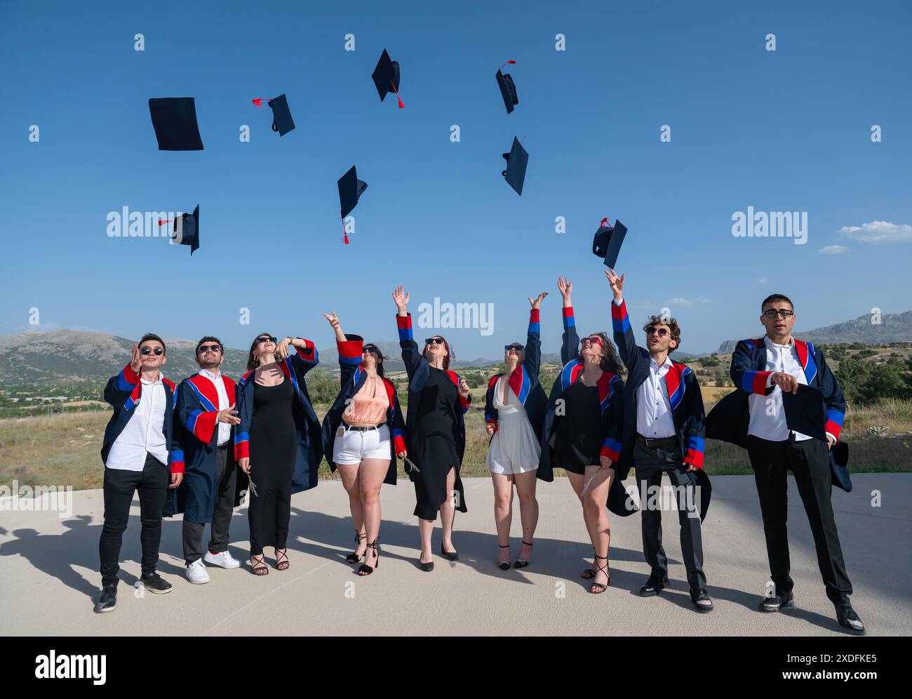 Graduate hat throwing hi-res stock photography and images - Alamy