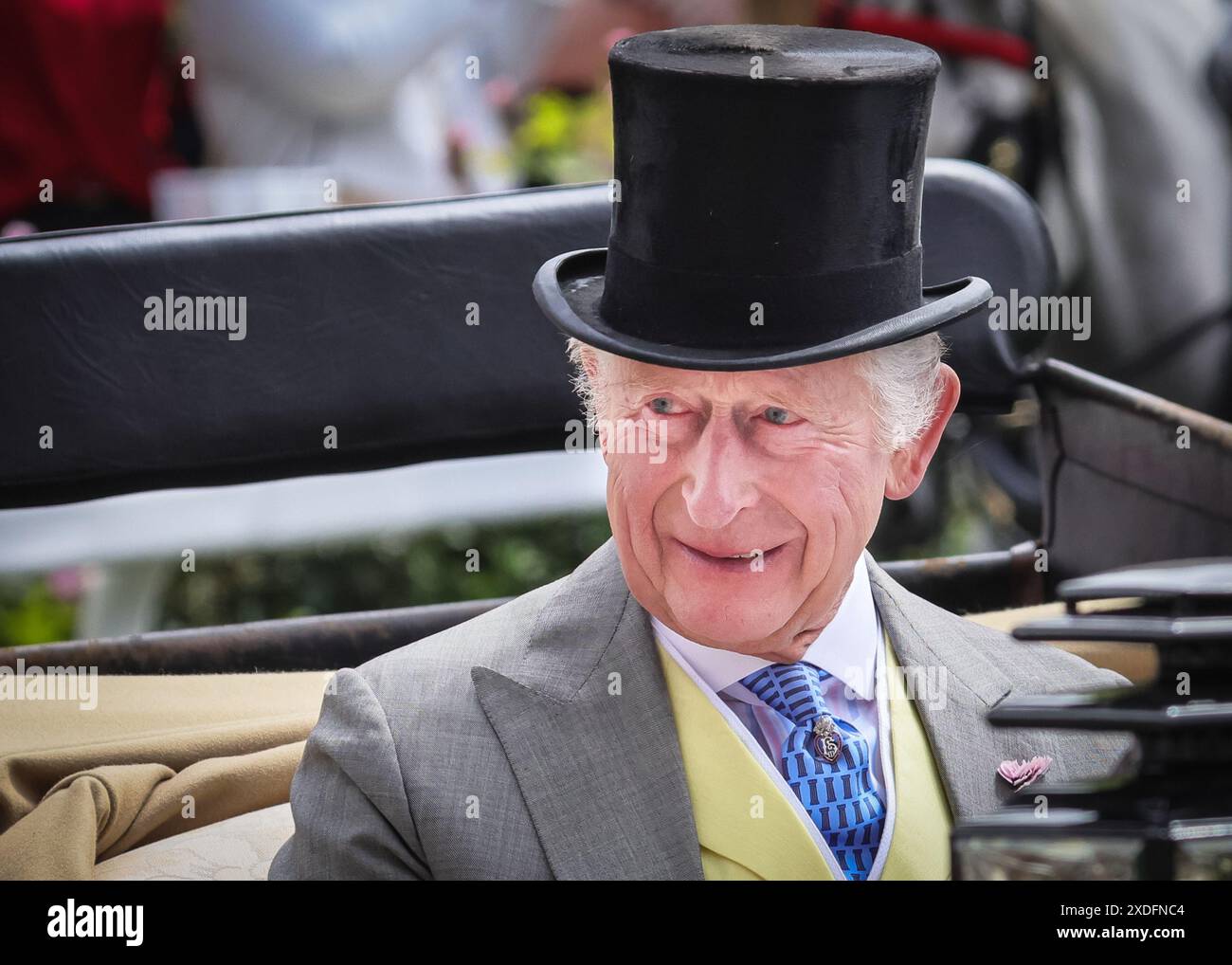 King Charles III, in top hat, smiles during the Royal Procession at ...