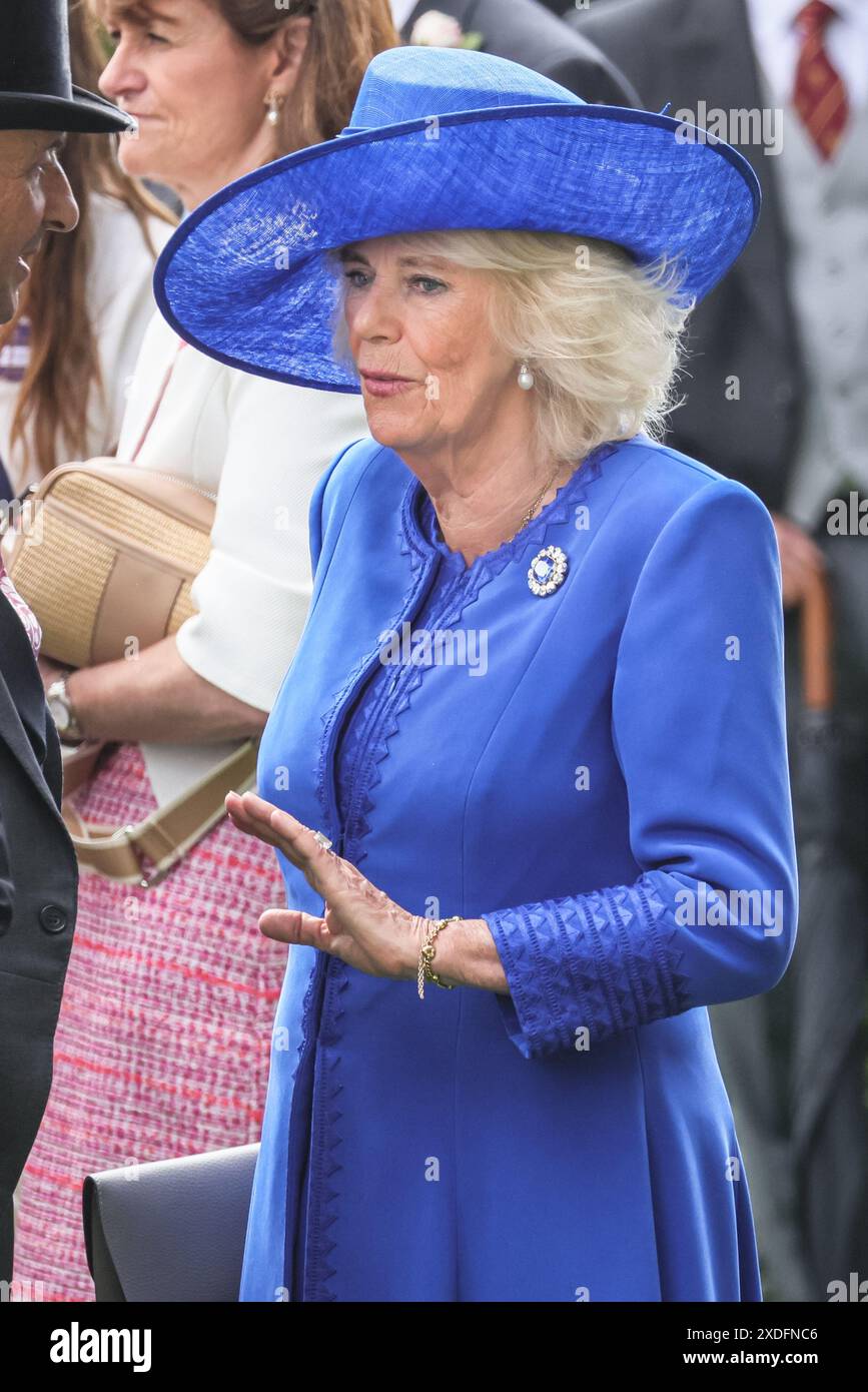Queen Camilla, in a cobald blue dress by Fiona Clare and Philip Tracey ...