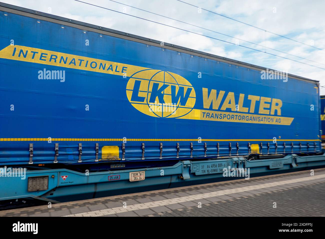 A blue freight container, branded with the „LKW Walter“ logo is parked ...