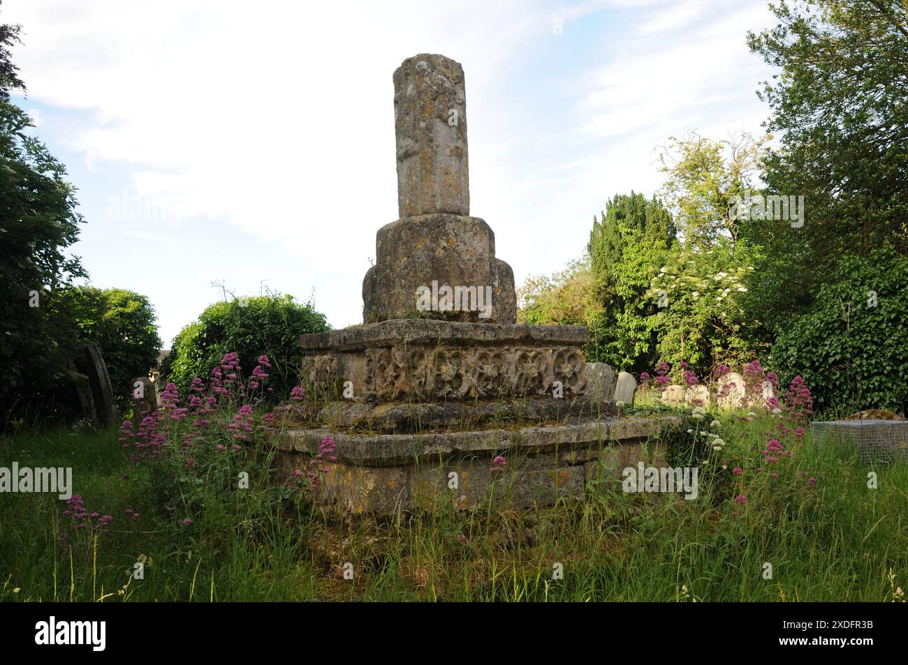 Stump of old cross in the churchyard of St Peter's Church, Raunds ...