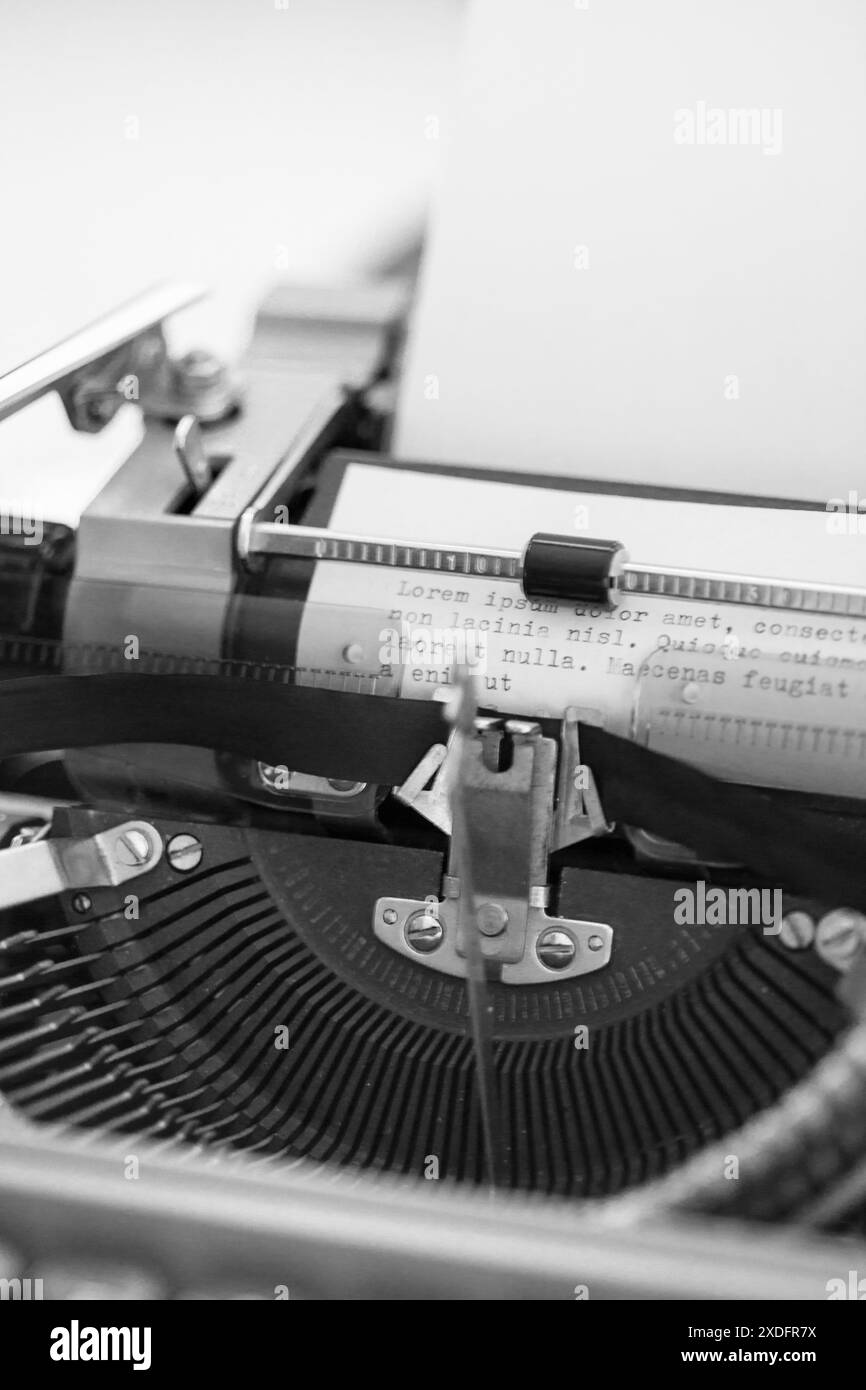 Vintage Typewriter machine with a sheet of paper and generic text typed ...