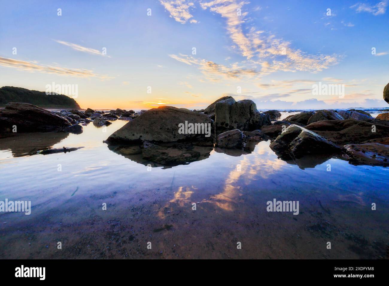 Scenic seascape at low tide on Hams beach in Caves beach town coast on ...