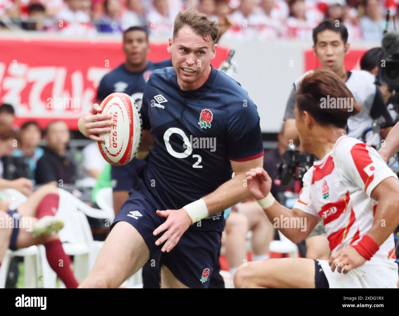 Tokyo, Japan. 22nd June, 2024. England's wing Tom Roebuck carries the ...