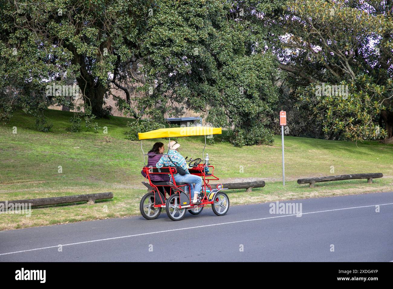 Centennial Park Sydney, two people cycling in a pedal car hired in the ...