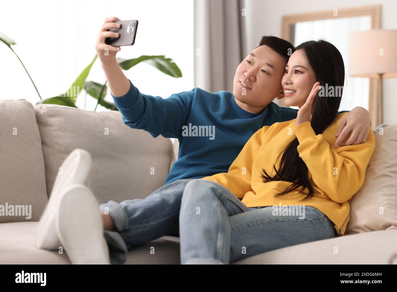 Happy young family taking hi-res stock photography and images - Alamy