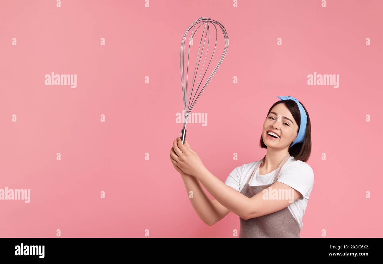 Happy pastry chef with big whisk on pink background. Banner design ...