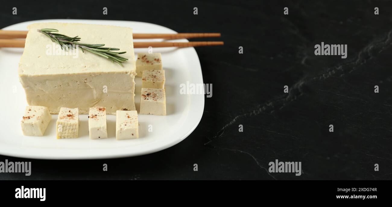 Delicious tofu with rosemary on black table, banner design Stock Photo ...