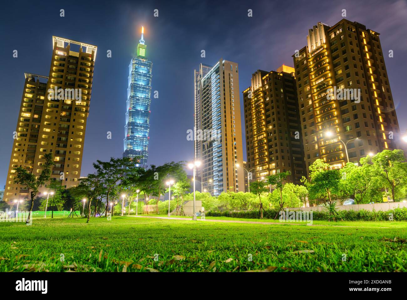 Awesome colorful night view of skyscraper and modern residential ...
