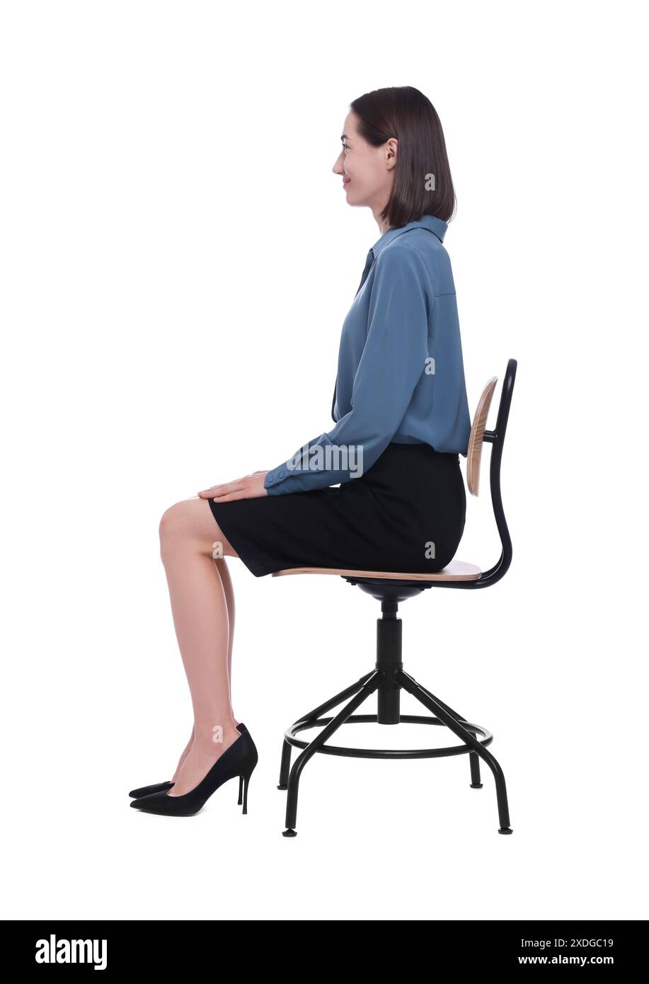 Woman with good posture sitting on chair against white background Stock ...