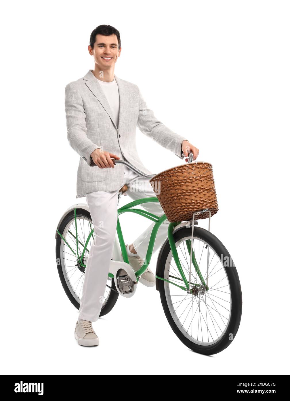 Smiling man on bicycle with basket against white background Stock Photo ...