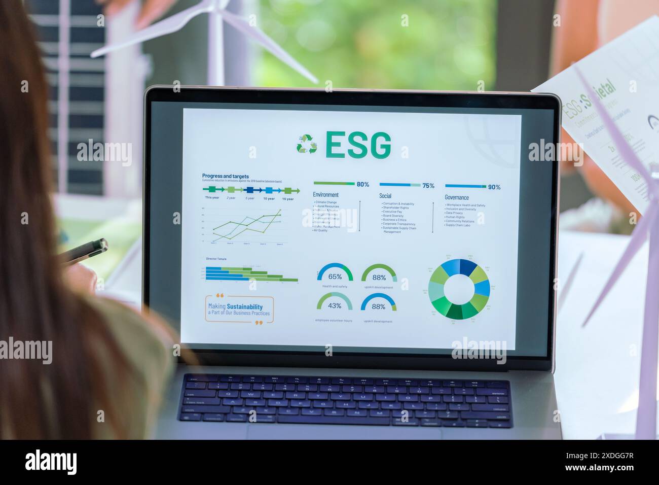 close up laptop show esg data chart at green office Stock Photo - Alamy