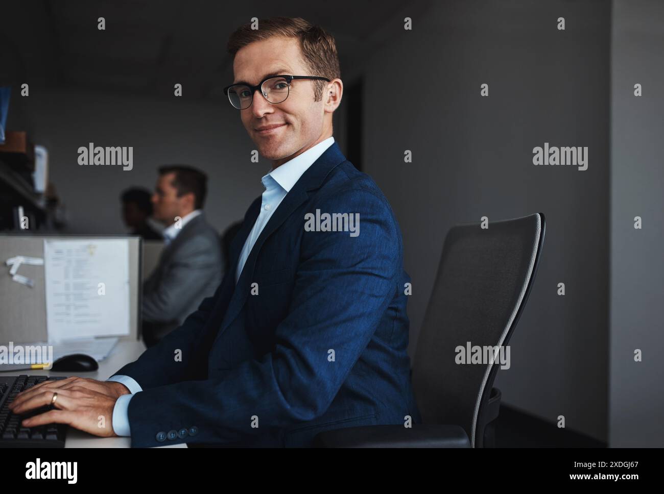 Office, portrait and business man in cubicle with computer, typing ...