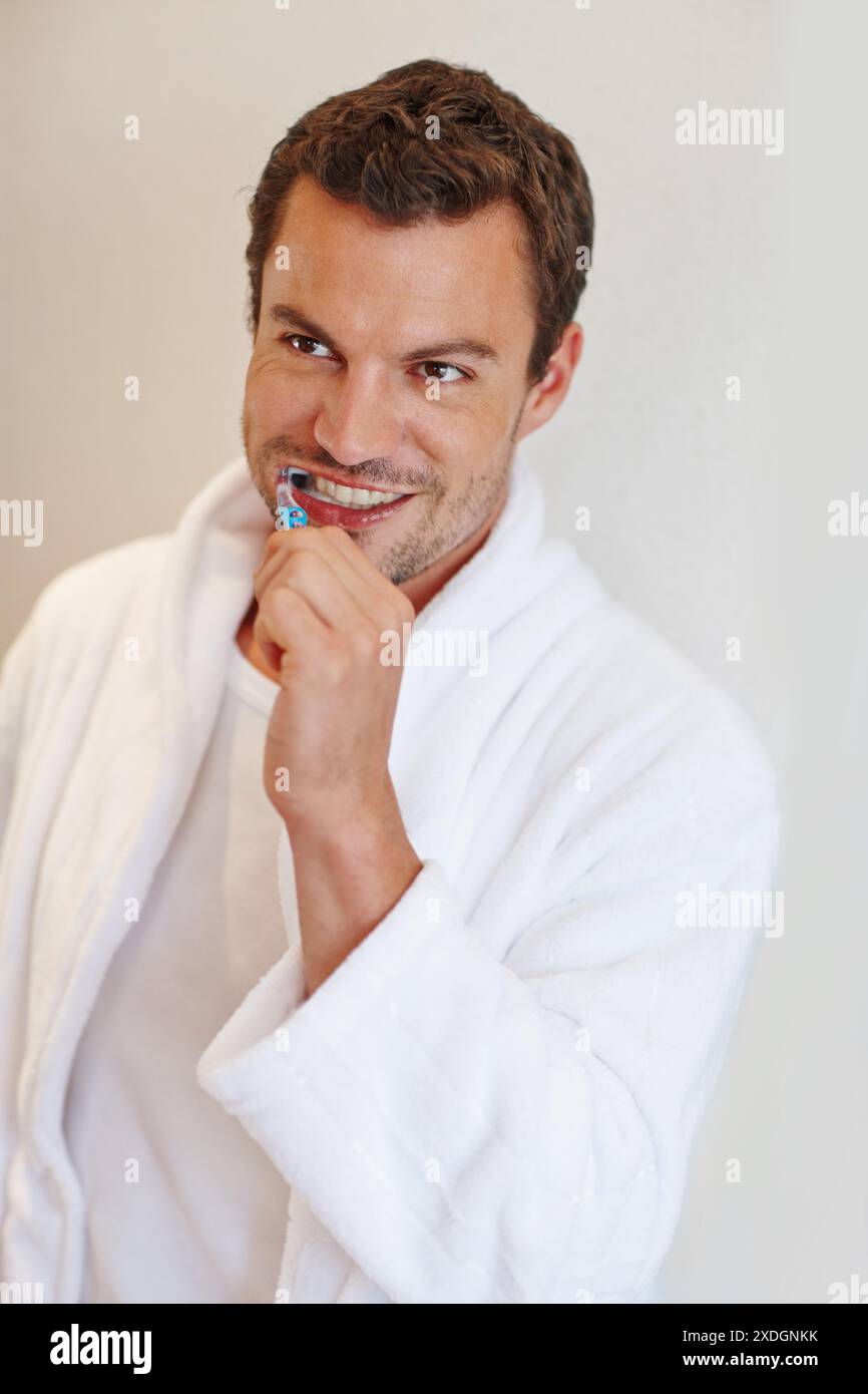 Toothbrush, man and brushing teeth in bathroom for oral hygiene ...