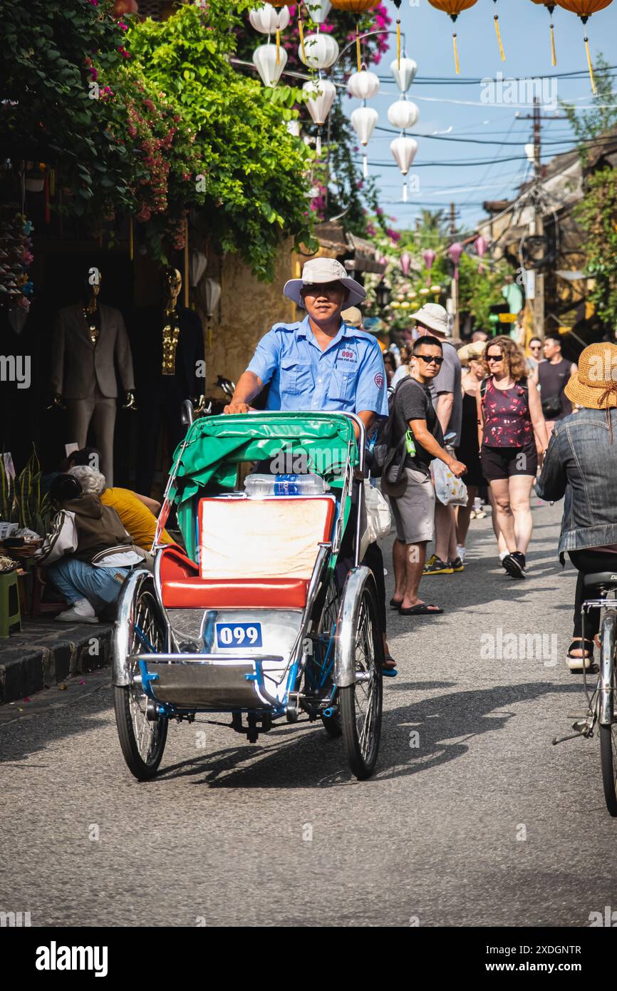 Vietnam Taxi tricycle service tourists by bike around town. Vietnamese ...