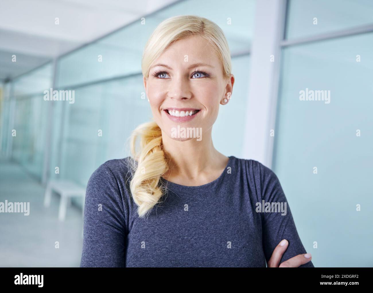 Future, smile and thinking with business woman in hallway of office for ...
