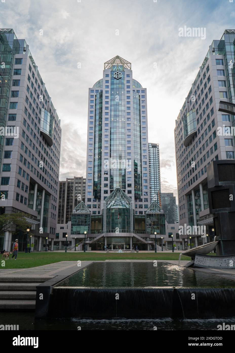 A vertical shot of the Metro Hall Building and the Eternal Flame At Metro Hall in daytime in ...