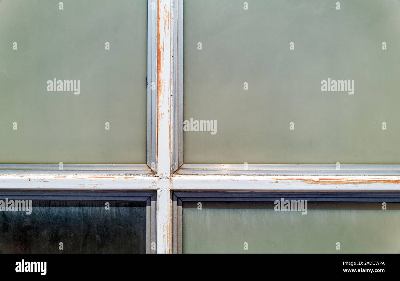 Details of intersecting window panes on an abandoned passenger rail ...