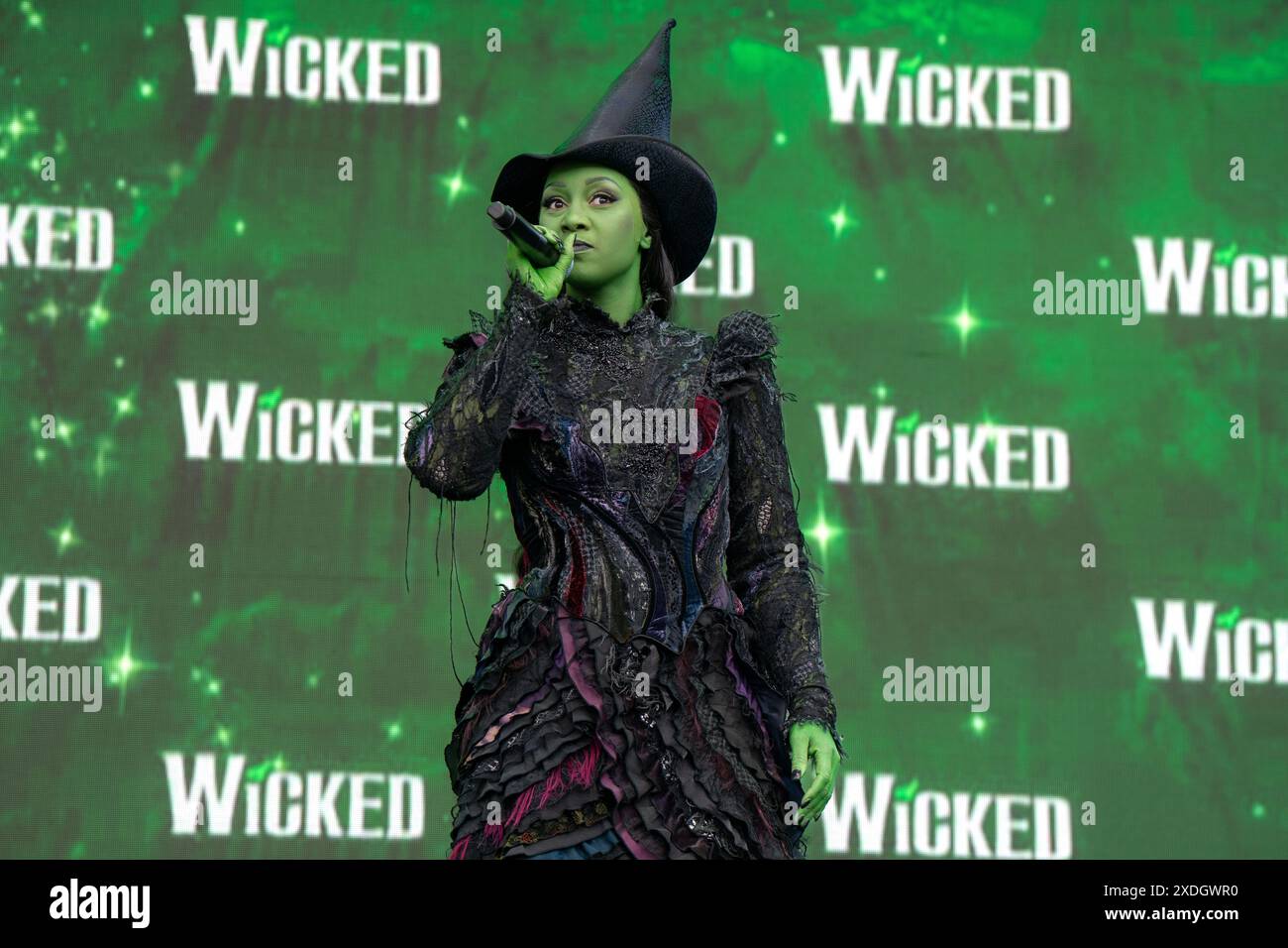 Alexia Khadime as Elphaba from musical Wicked seen singing on stage in ...