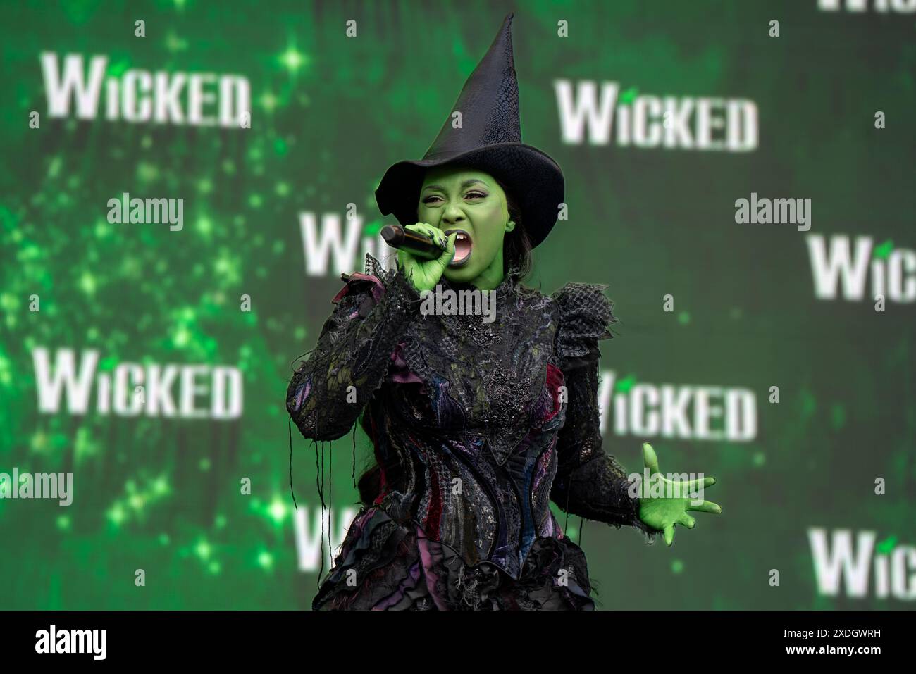 Alexia Khadime as Elphaba from musical Wicked seen singing on stage in ...