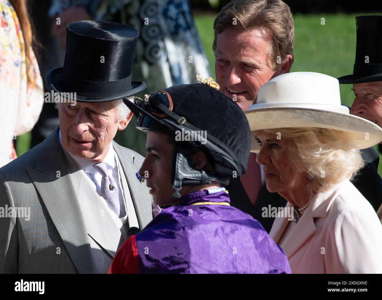 Ascot, UK. 22nd June, 2024. The King and Queen Camilla chat to trainer ...