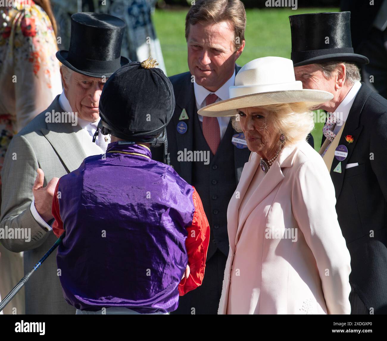 Ascot, UK. 22nd June, 2024. The King and Queen Camilla chat to trainer ...