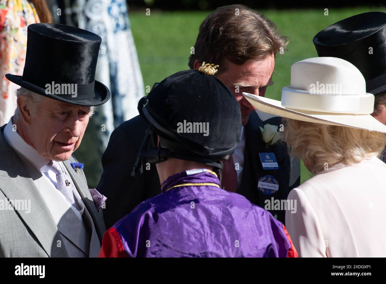Ascot, UK. 22nd June, 2024. The King and Queen Camilla chat to trainer ...