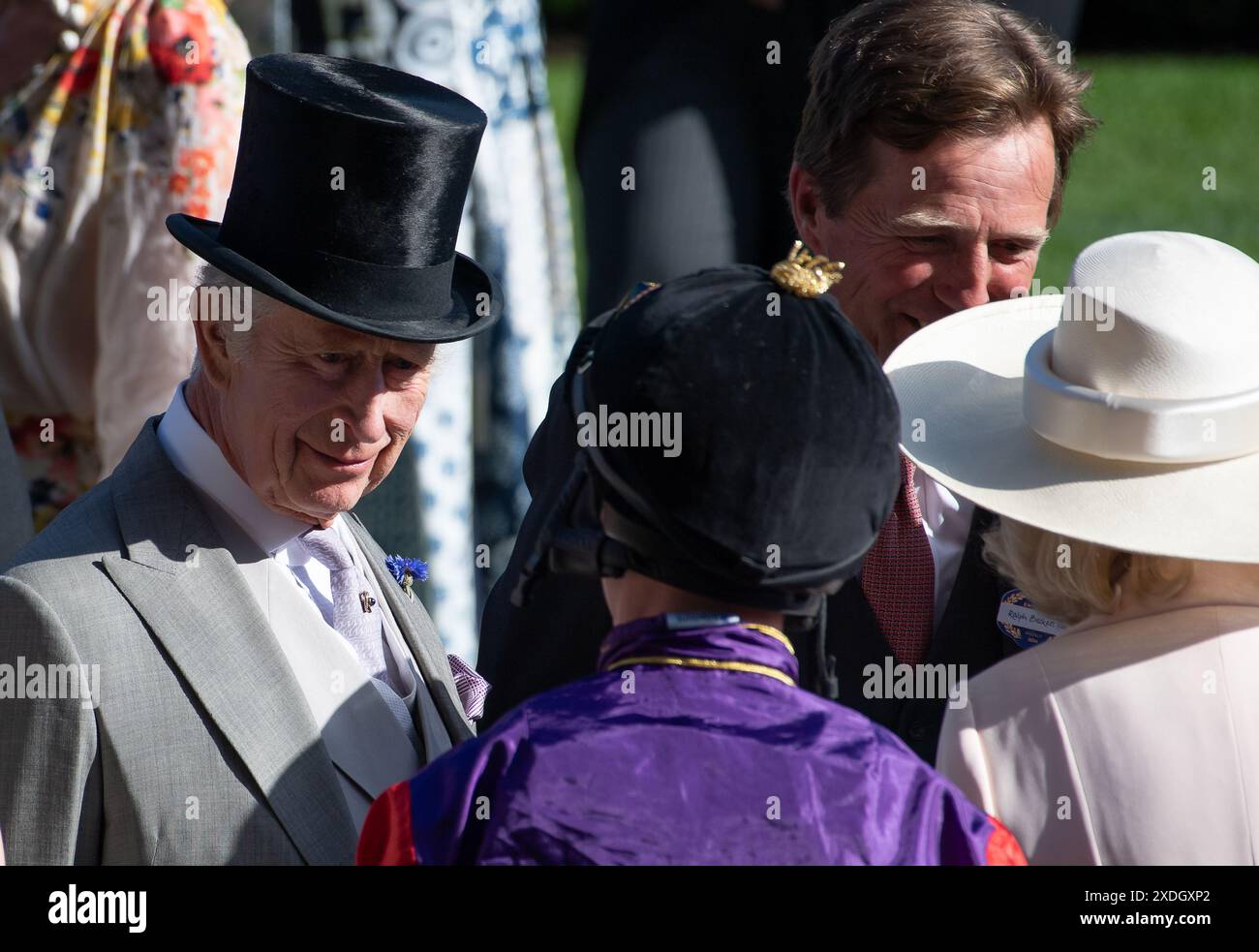 Ascot, UK. 22nd June, 2024. The King and Queen Camilla chat to trainer ...