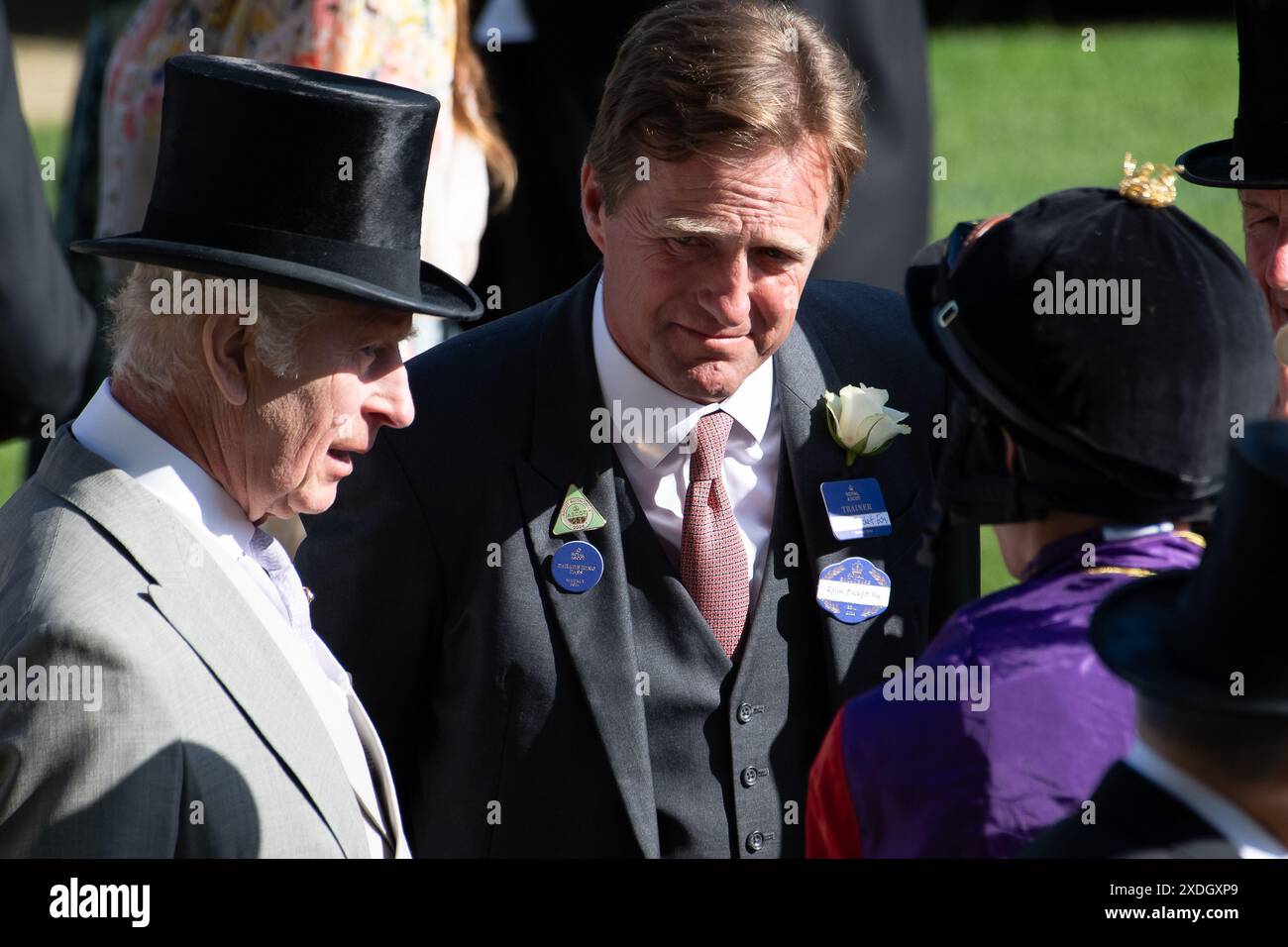 Ascot, UK. 22nd June, 2024. The King and Queen Camilla chat to trainer ...