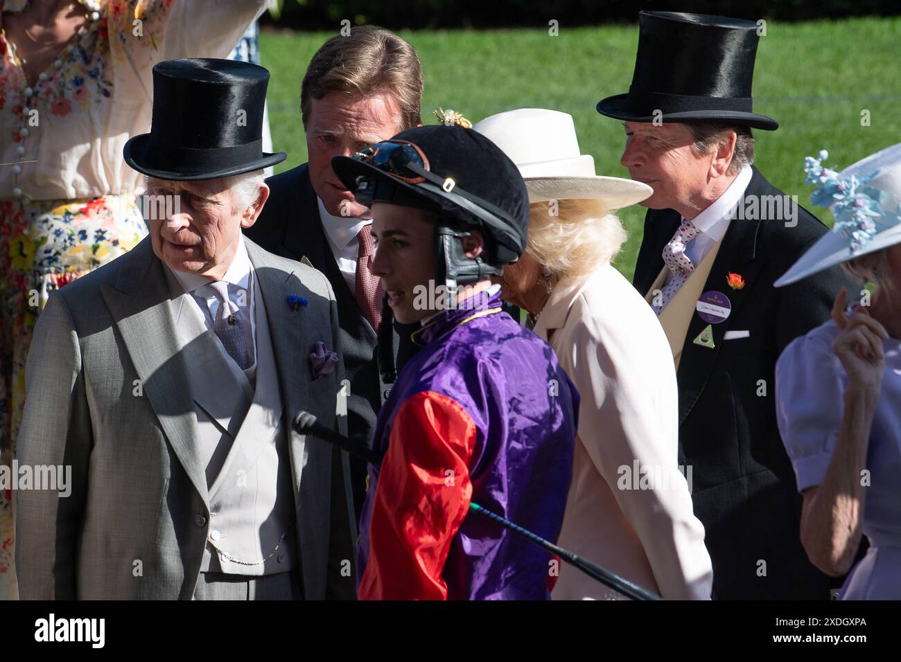Ascot, UK. 22nd June, 2024. The King and Queen Camilla chat to trainer ...