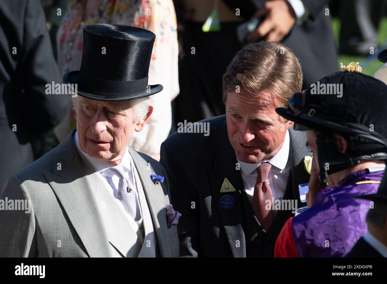 Ascot, UK. 22nd June, 2024. The King and Queen Camilla chat to trainer ...