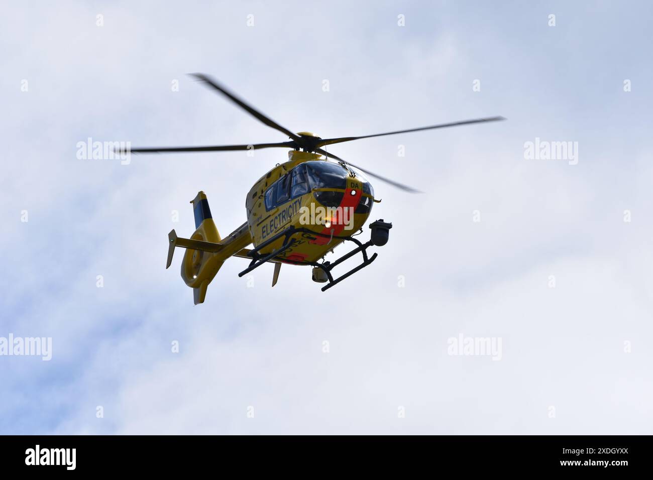 A high-visibility Airbus H135 helicopter, operated by National Grid ...