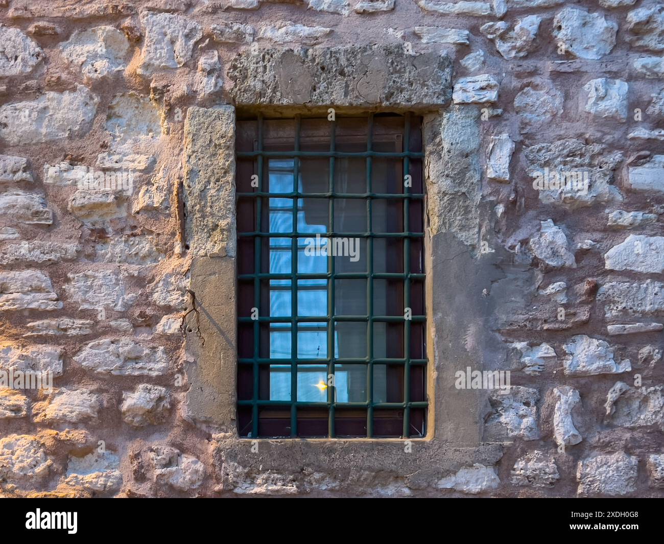 Istanbul, Turkey - May 5, 2024: A rustic stone wall with a single ...