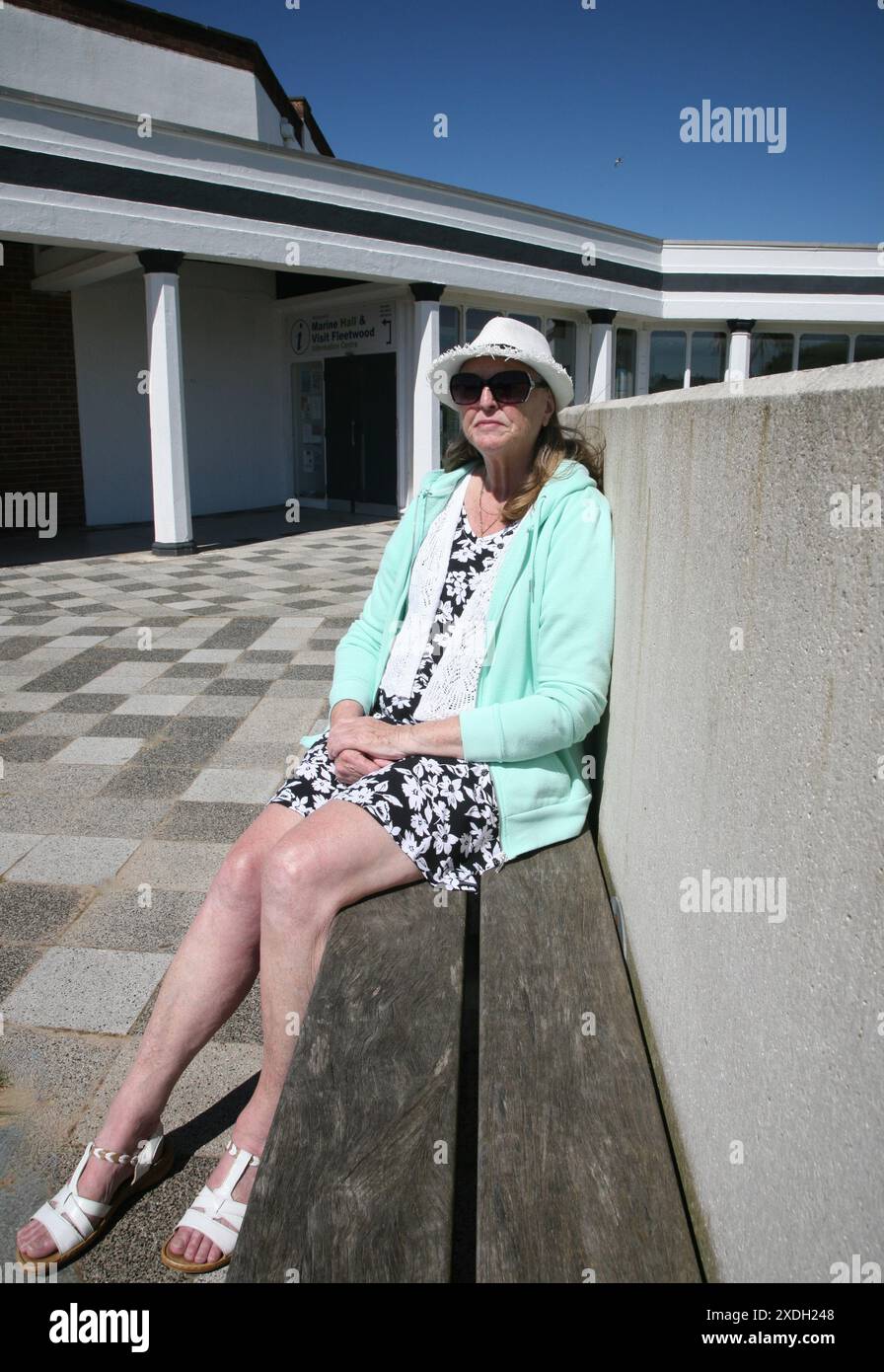 A pretty lady outside the Marine Hall in Fleetwood, Lancashire, U.K ...