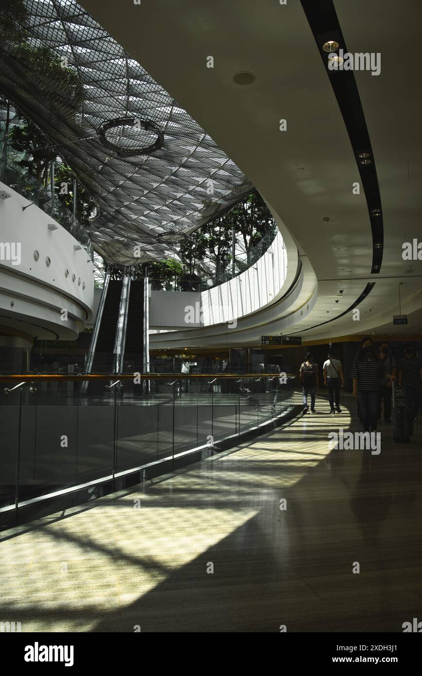 Interior of Jewel Changi shopping mall in Singapore, illuminated by ...