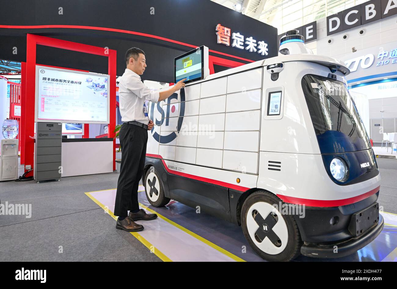 Tianjin. 20th June, 2024. An exhibitor operates an unmanned autonomous ...