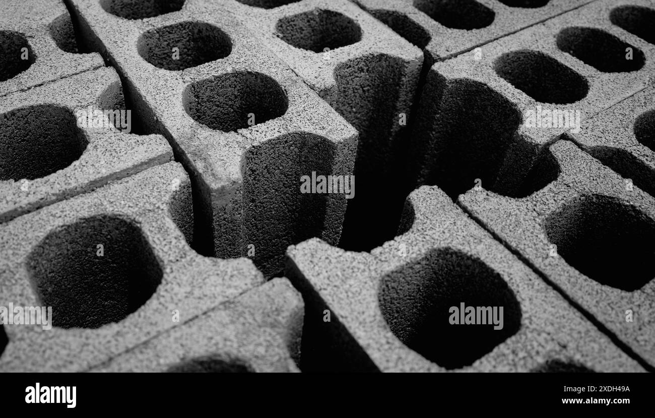 Concrete blocks with holes stacked on top of each other Stock Photo - Alamy