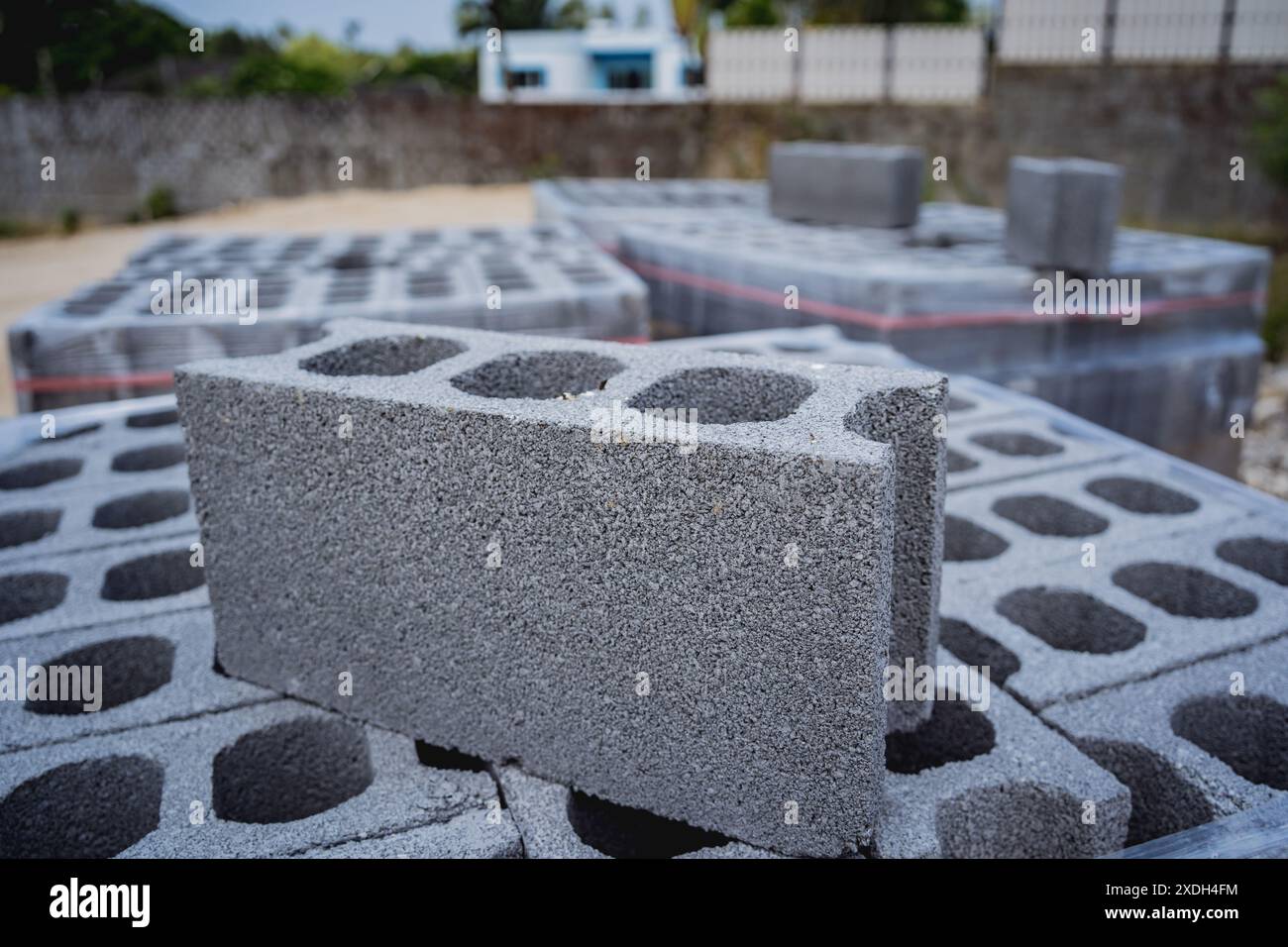 Concrete blocks with holes stacked on top of each other Stock Photo - Alamy