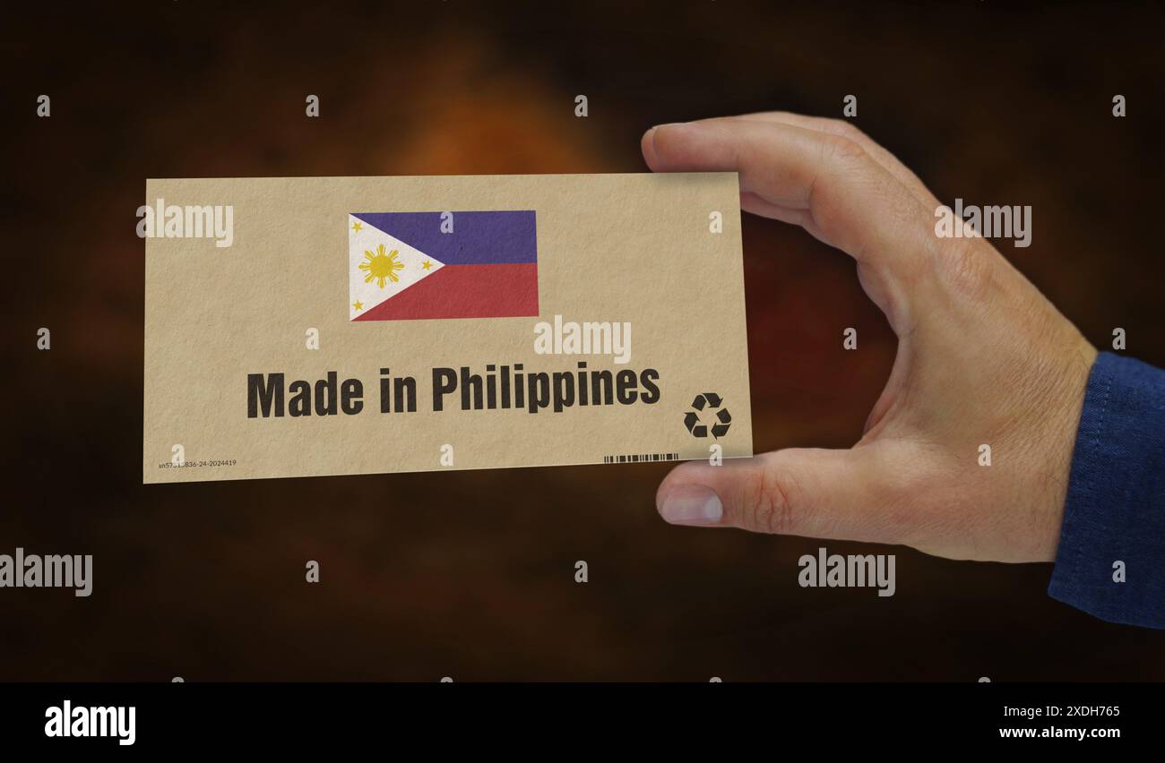 Made in Philippines Philippines box in hand. Filipino, flag ...