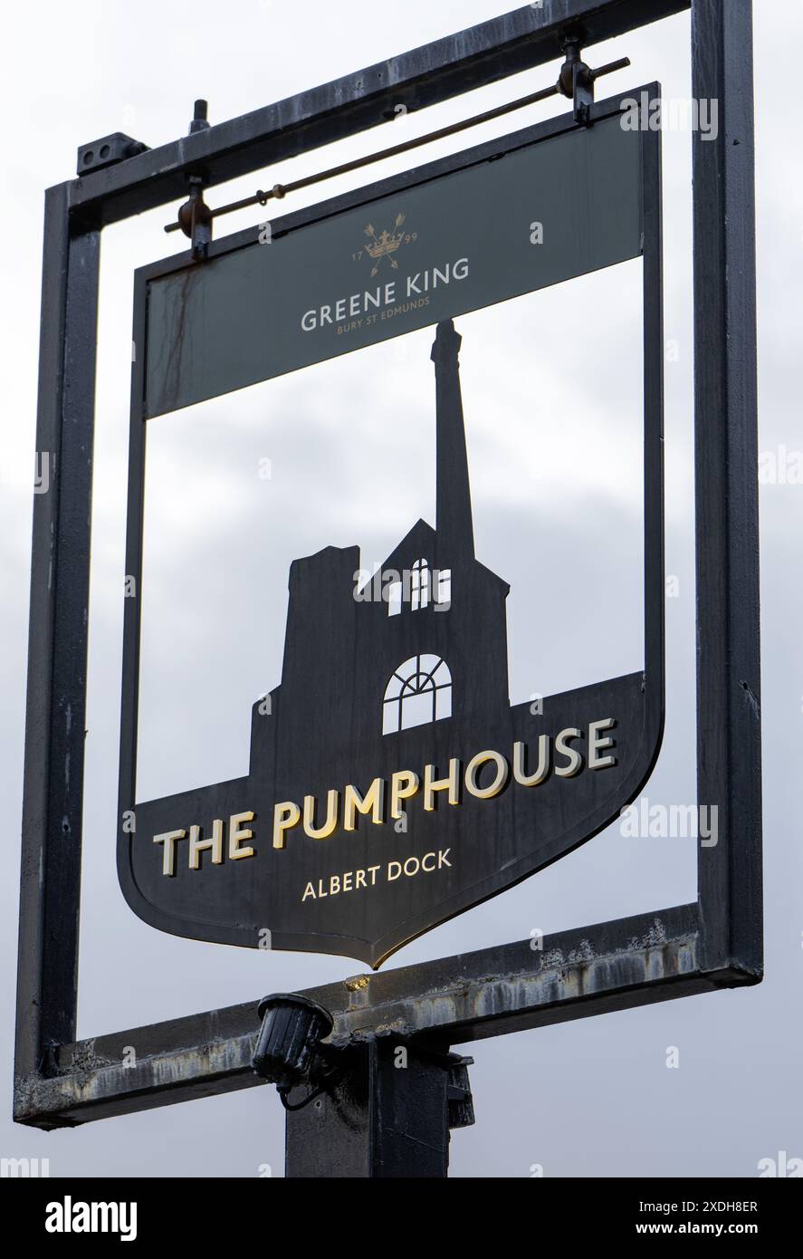 Traditional hanging pub sign at The Pumphouse - a Green King public ...