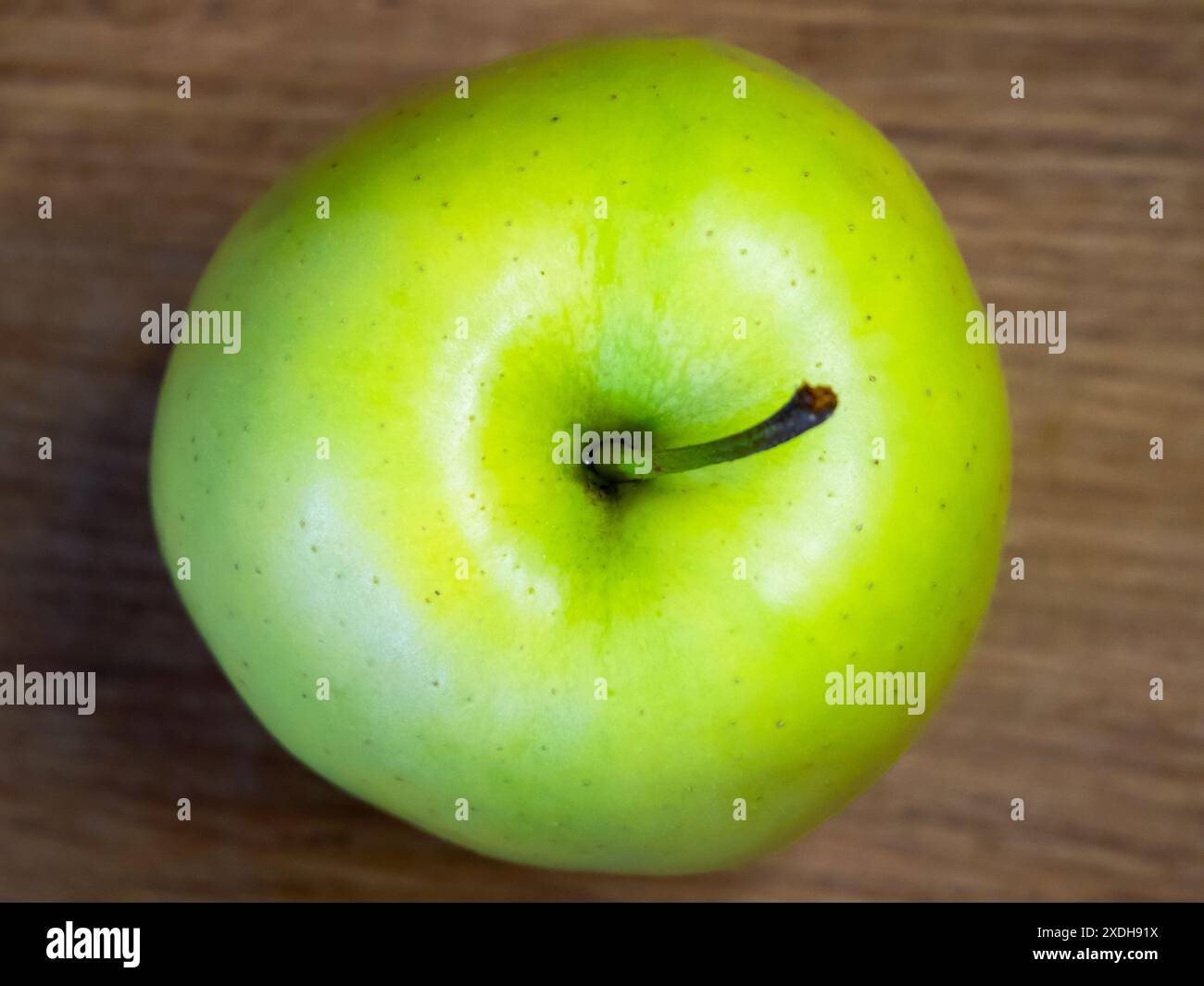 The apple looks ripe and ready to eat, emphasizing nutrition and ...