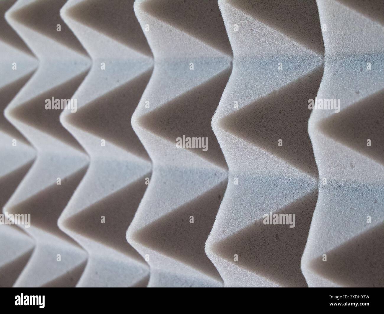 Noise Control Panels. Grey acoustic foam with a repetitive pyramid ...