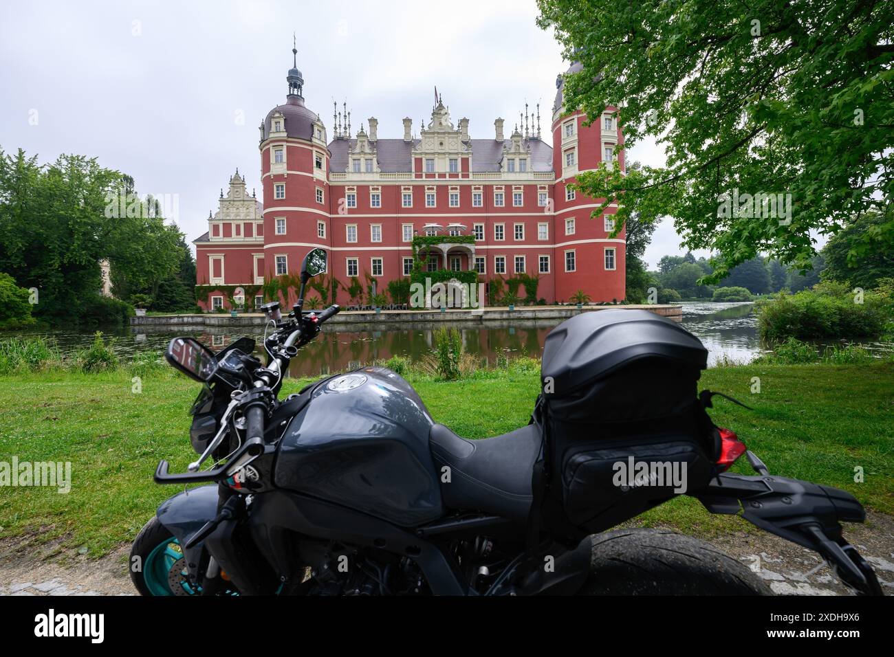 Bad Muskau, Germany. 20th June, 2024. A motorcycle is parked in front ...
