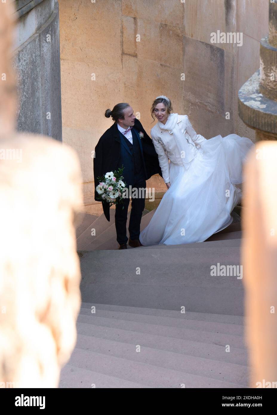 Walk of the newlyweds. The bride and groom go up the steps. Photo ...