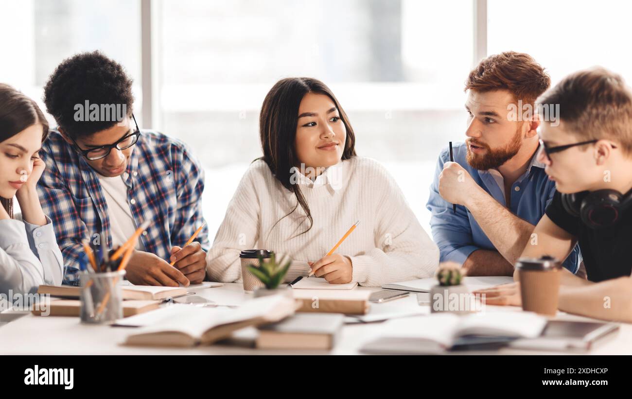 People Multiethnic Students Sitting Around a Table Stock Photo - Alamy
